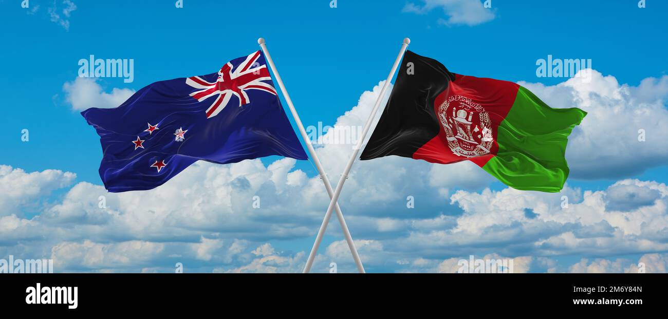 two crossed flags Afghanistan and New Zeeland waving in wind at cloudy sky. Concept of ...