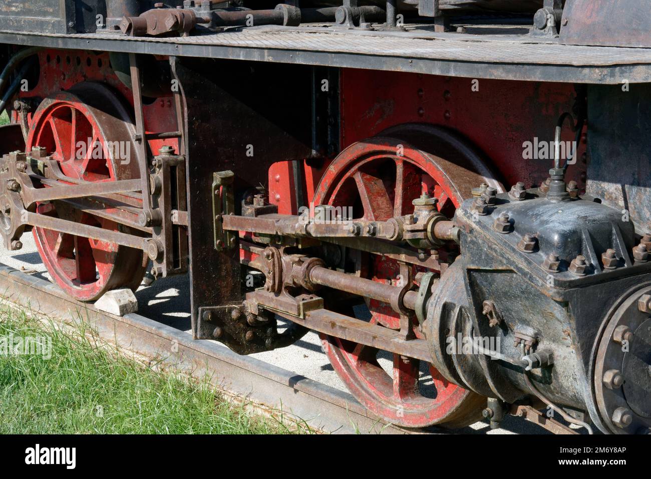 Particular view of iron wheels of the italian oldest steam locomotive ...