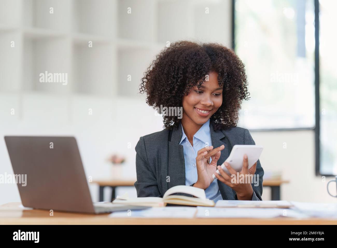 Financial advisor, corporate accountant and african woman in office ...