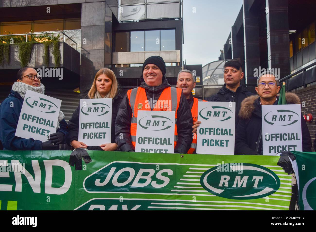 London, England, UK. 6th Jan, 2023. Rail workers stand at the RMT (Rail ...