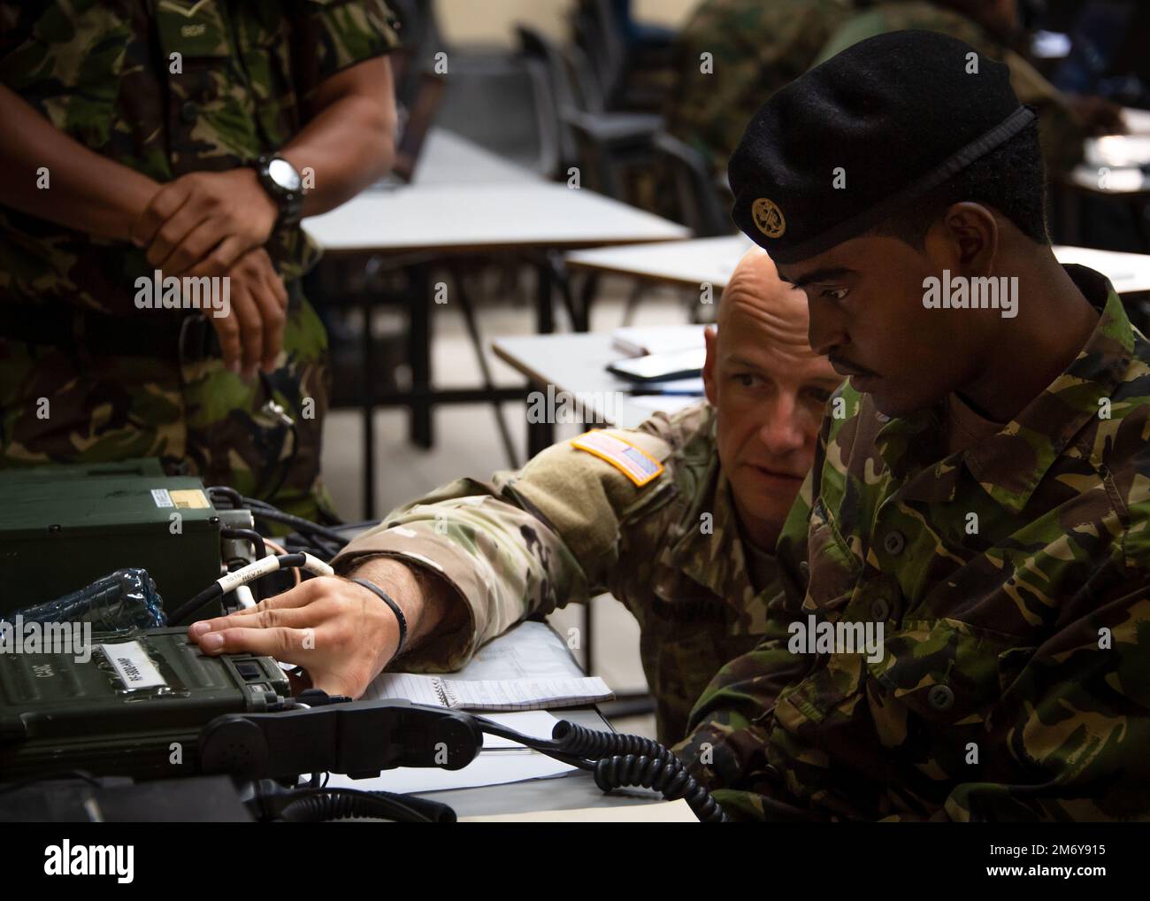 Staff Sergeant Tyler Bingham (United States Army, left), mentors ...