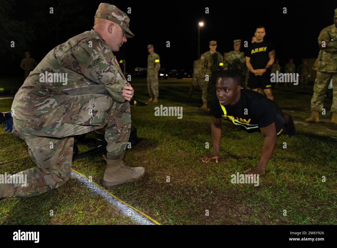 Pfc. Emeka Watson (right), a military police officer with the 661st ...