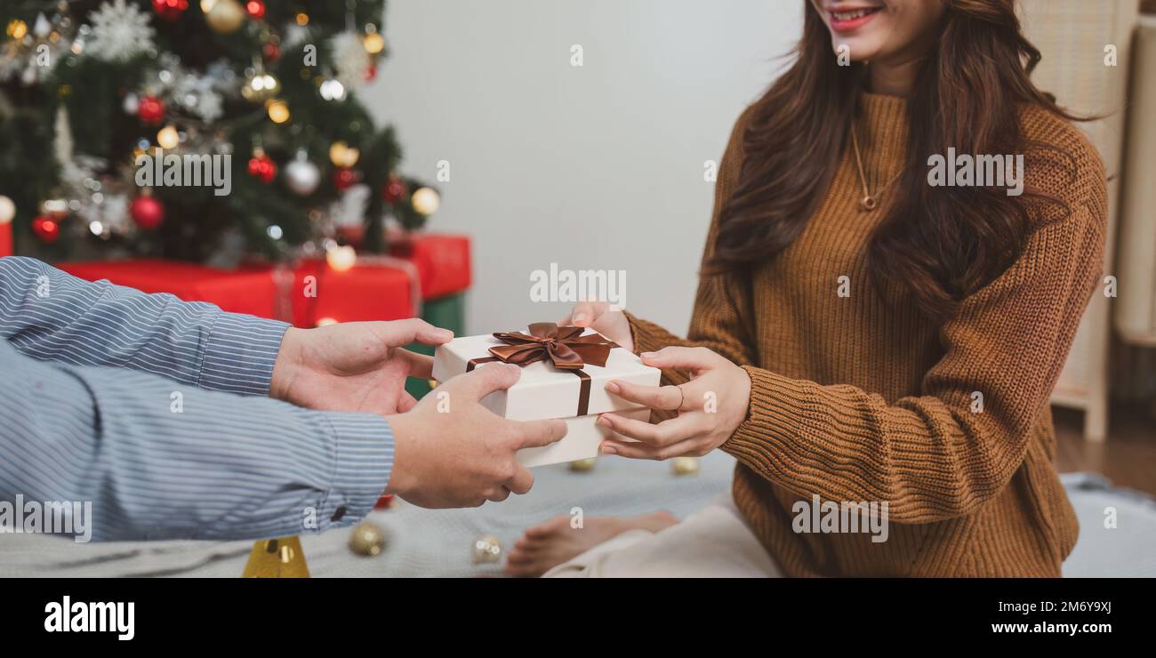 Cheerful lady surprised of the present after the opening in the gift ...