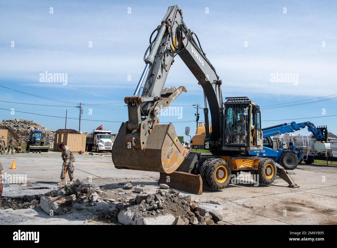 A rapid airfield damage repair team with the 374th Civil Engineer ...