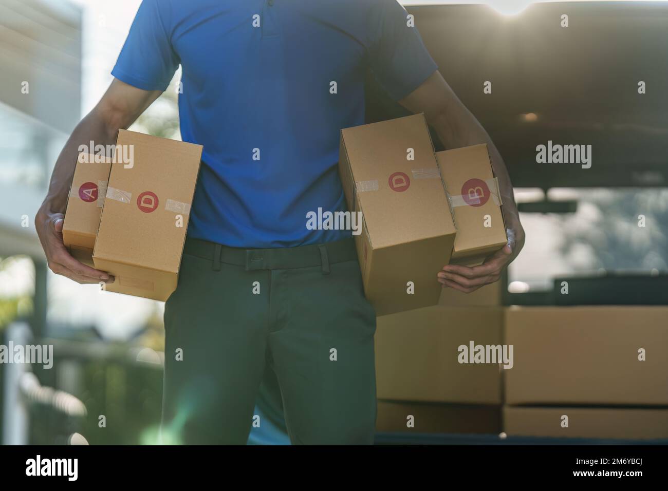 Asian courier with parcel and delivery logistic concept. Delivery man ...