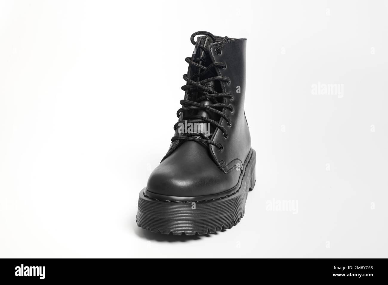 One black women combat boot on high heel platform with lug sole on ...