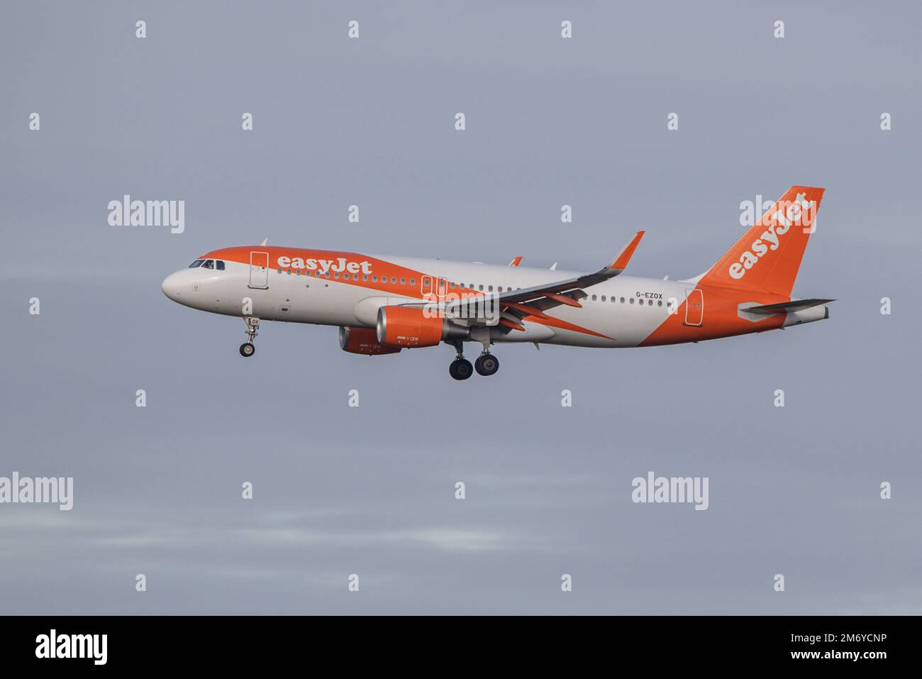 An Easy Jet Airbus A320-214 lands at Manchester Airport on the eve of ...