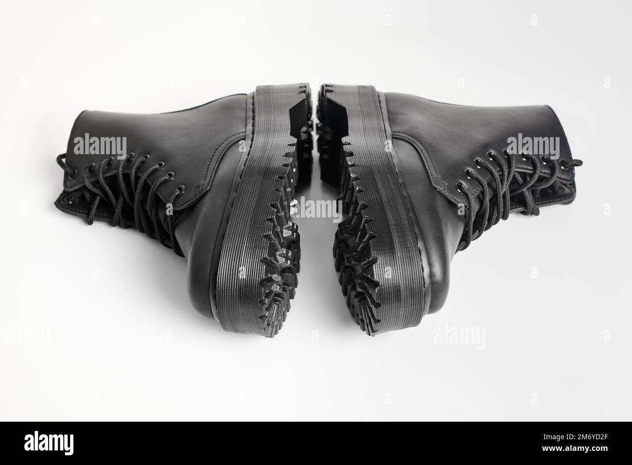 Black women combat boots on high heel platform with lug soles lying on ...