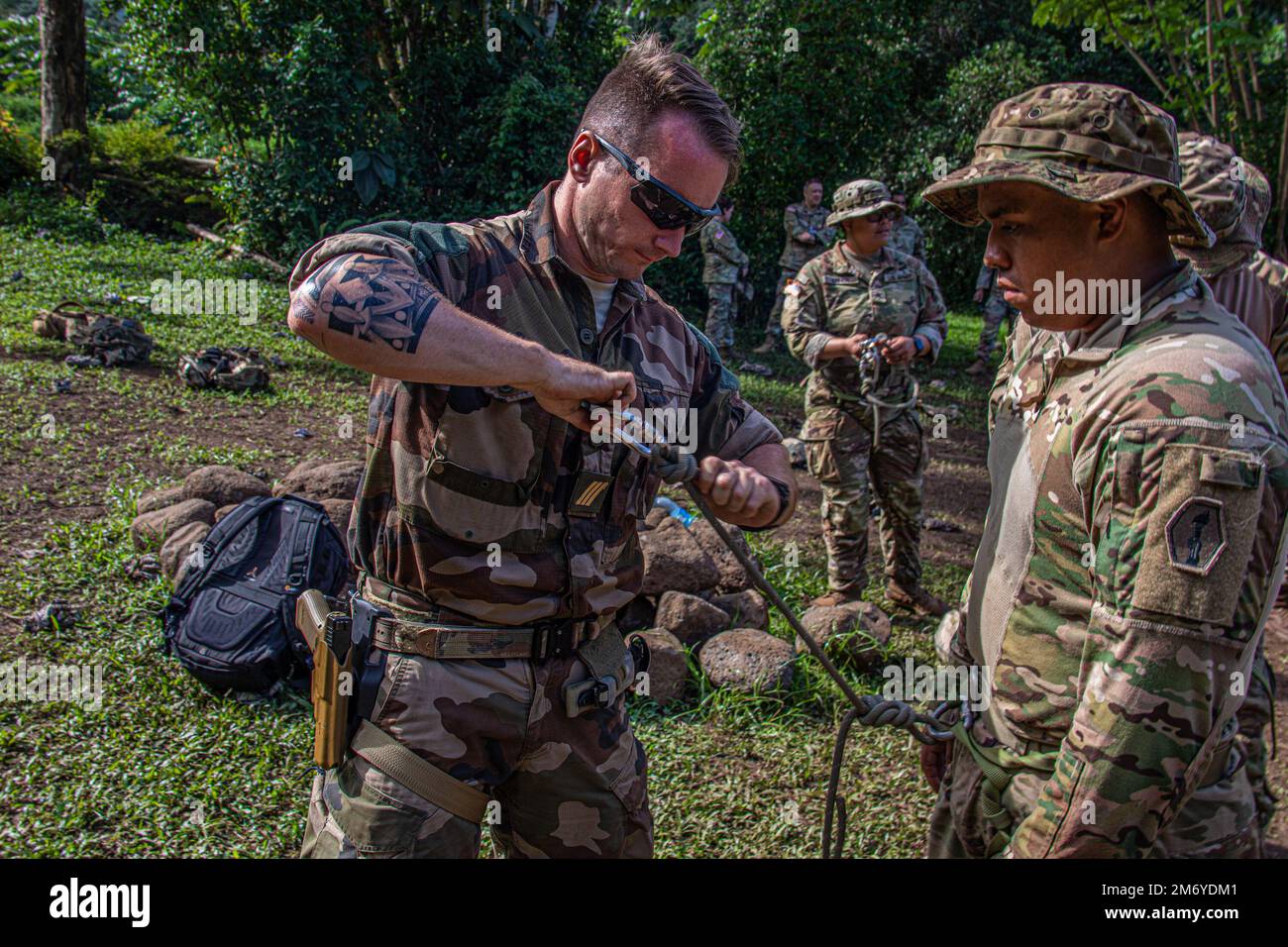 A French chief sergeant checks a U.S. Army soldier’s rappel seat before ...