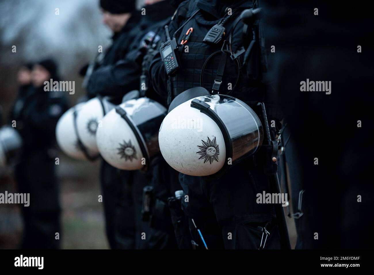 Erkelenz, Germany. 06th Jan, 2023. Police officers wear helmets on ...