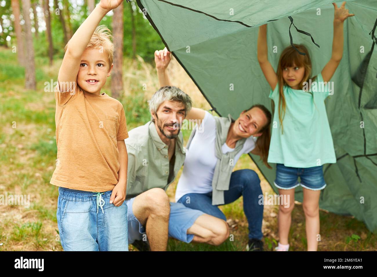 Setting up tent boy and girl hi-res stock photography and images - Alamy