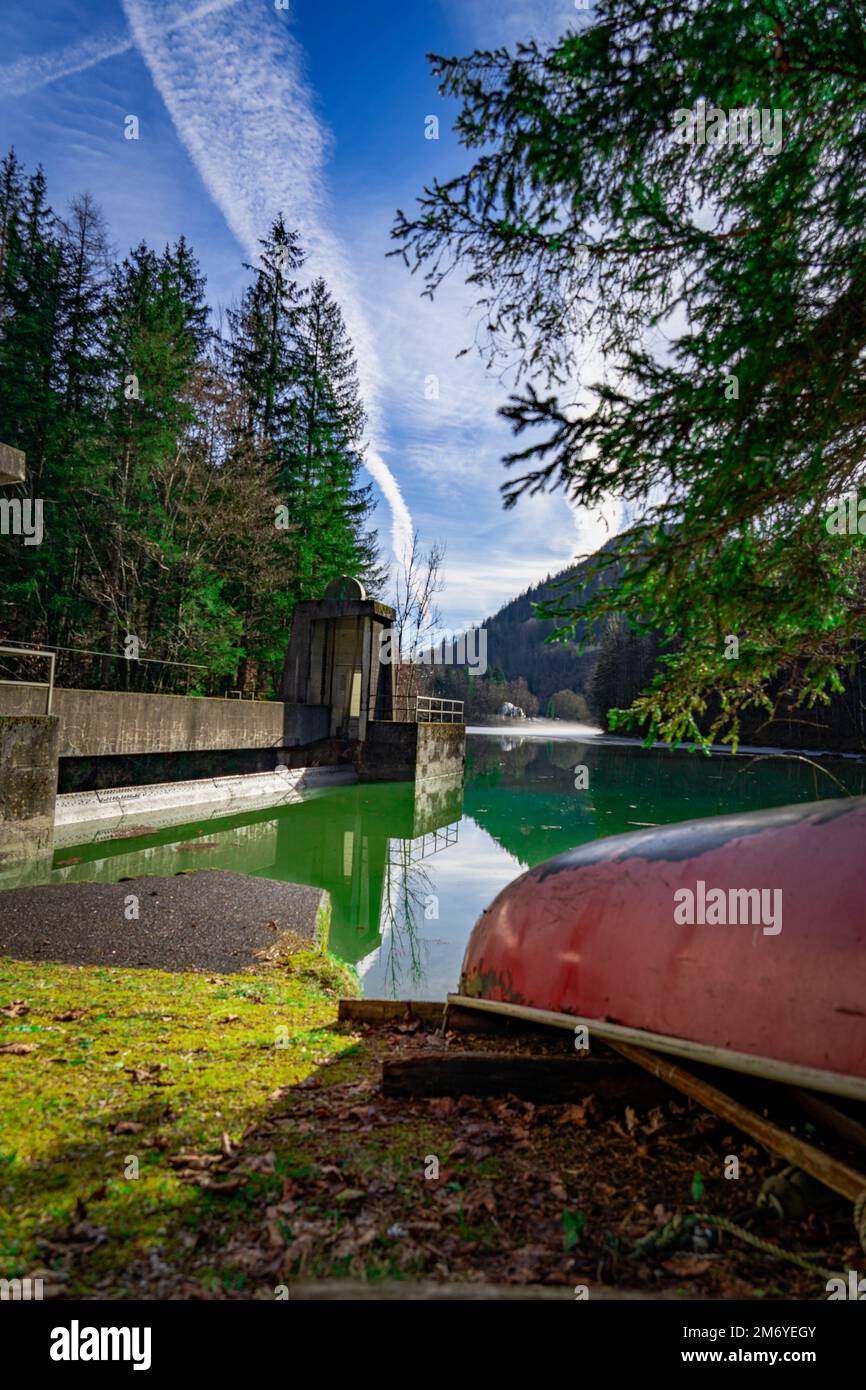 A beautiful landscape with a small artificial lake surrounded by ...