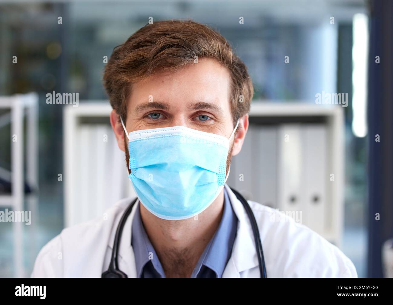 Portrait, man and doctor with covid face mask in hospital for medical ...