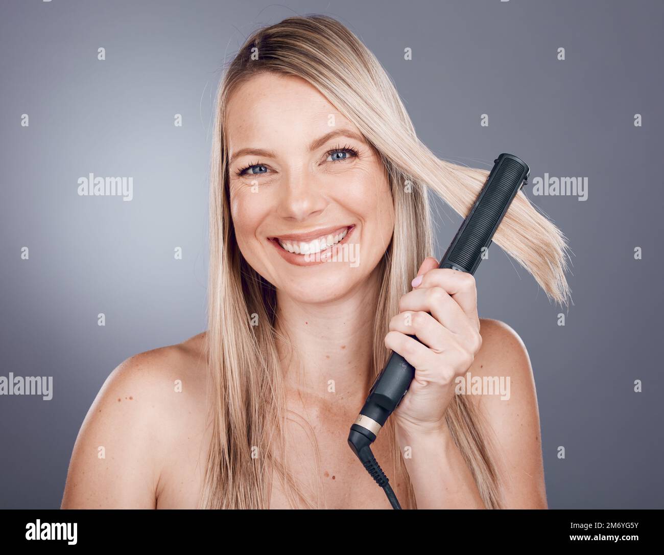 Woman, hair care portrait and flat iron with smile, beauty and ...