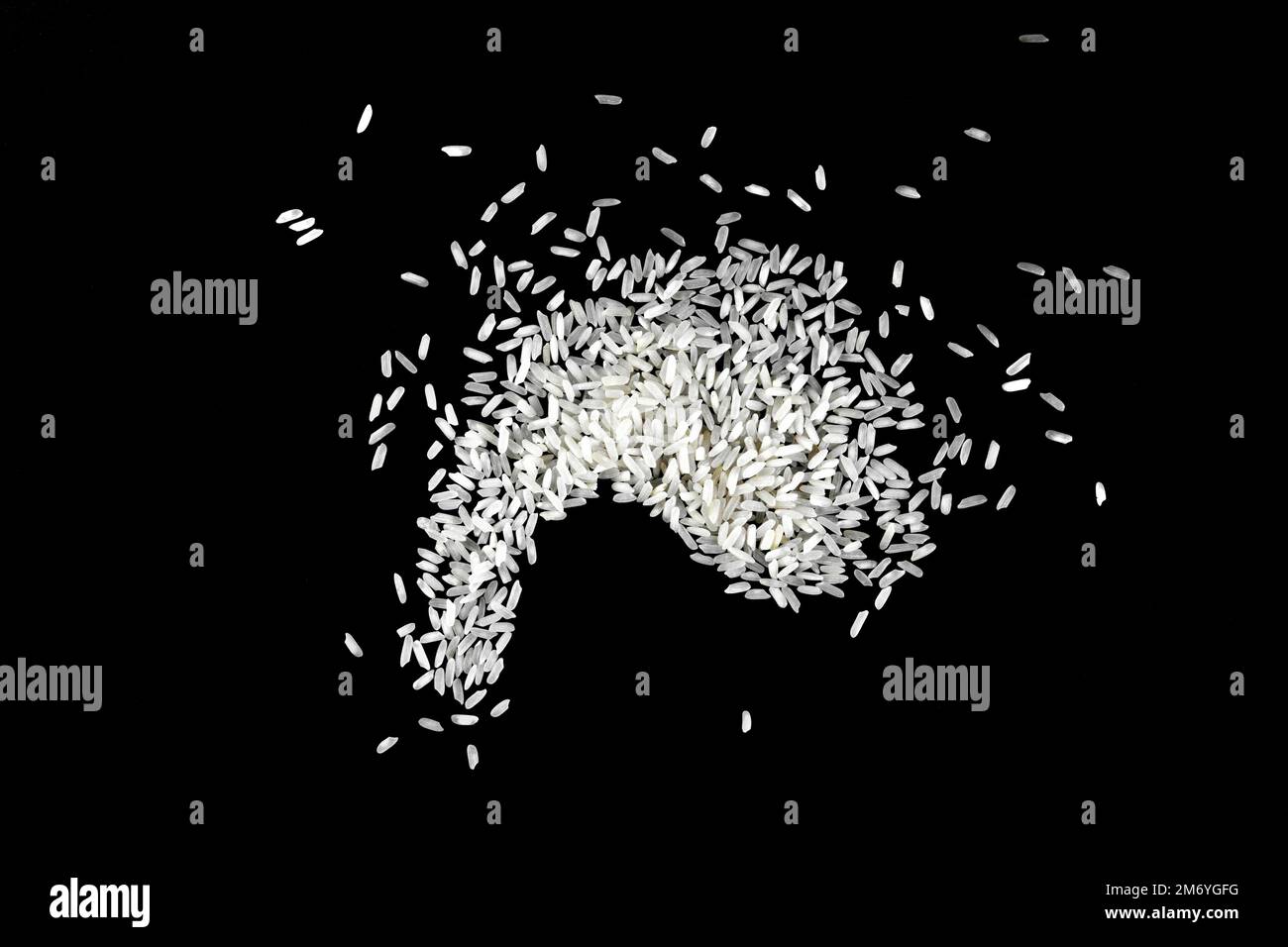 Rice spilled on a black background. Raw white rice explosion isolated ...