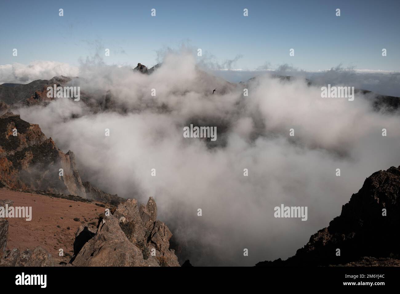 Cloud inversion covering the mountains on the trail from Pico do ...