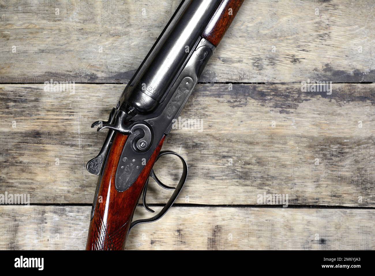 Old Vintage Classic trigger double-barreled hunting rifle on a wooden ...