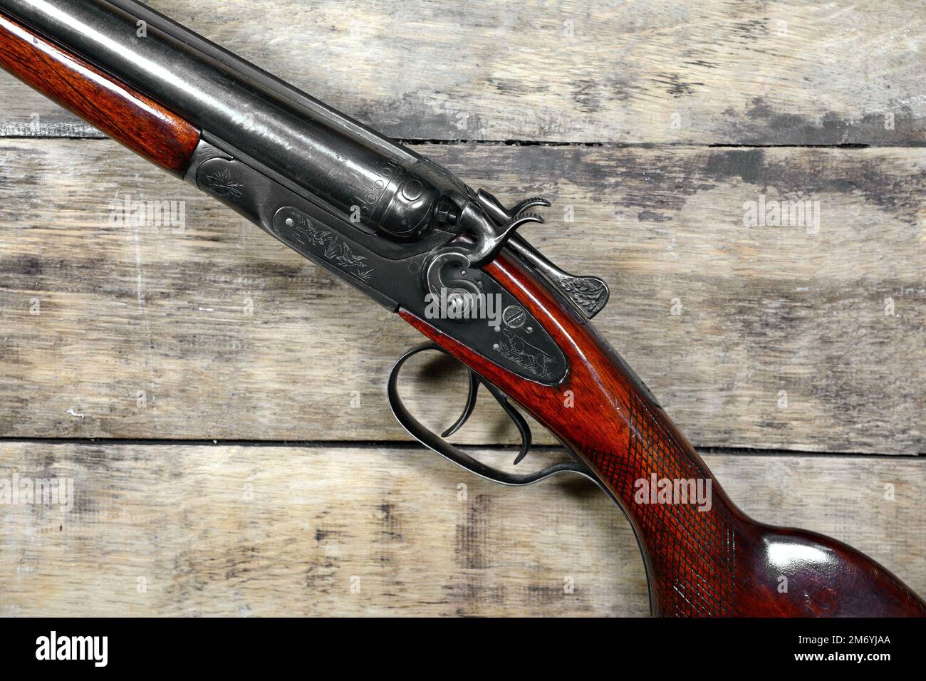 Old Vintage Classic trigger double-barreled hunting rifle on a wooden ...
