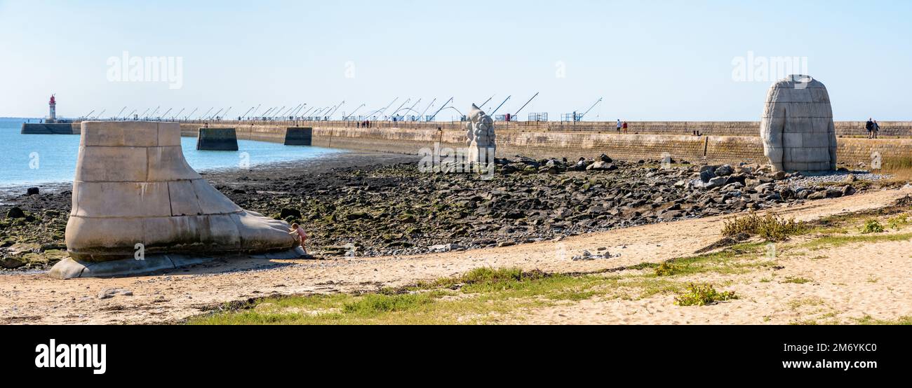 Three large sculptures representing a foot, a sweater and a digestive ...