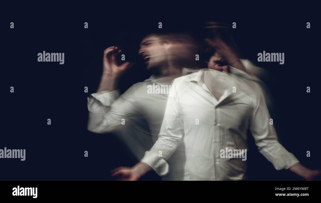 man with mental disorders and schizophrenic disease in white shirt on ...