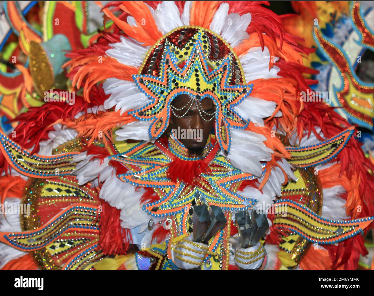 A man in a traditional costume during a Junkanoo parade in the Bahamas ...