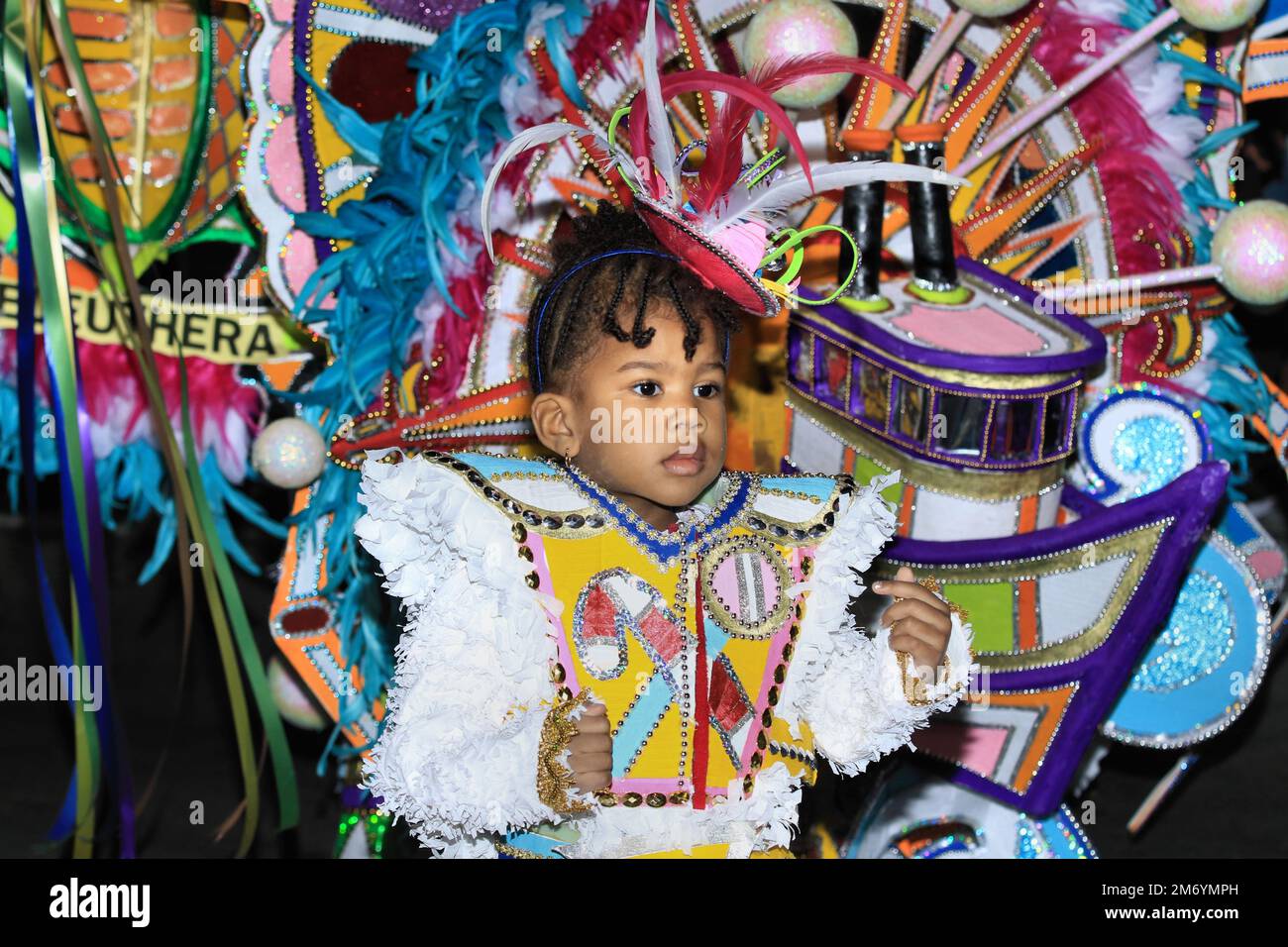 A kid in a traditional costume during a Junkanoo parade in the Bahamas ...