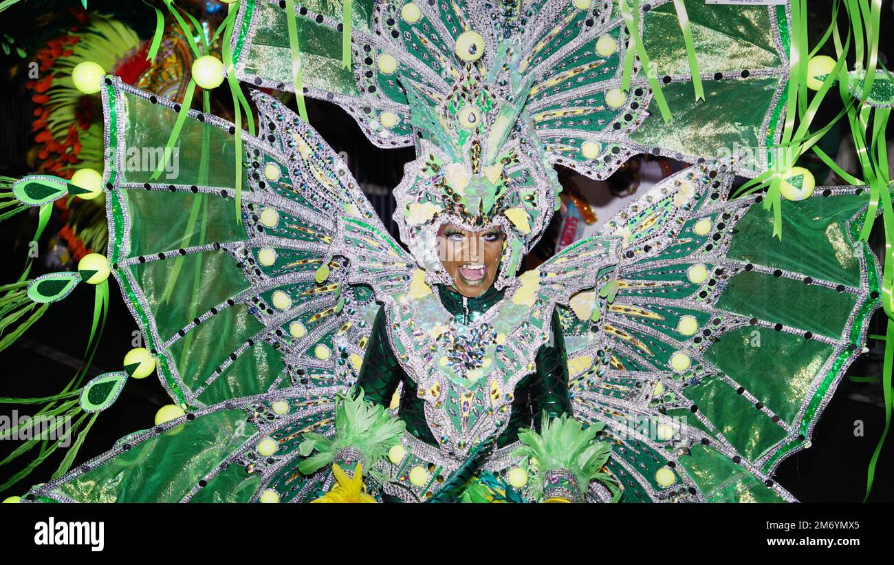 A woman dancing in a traditional costume during a Junkanoo parade in ...