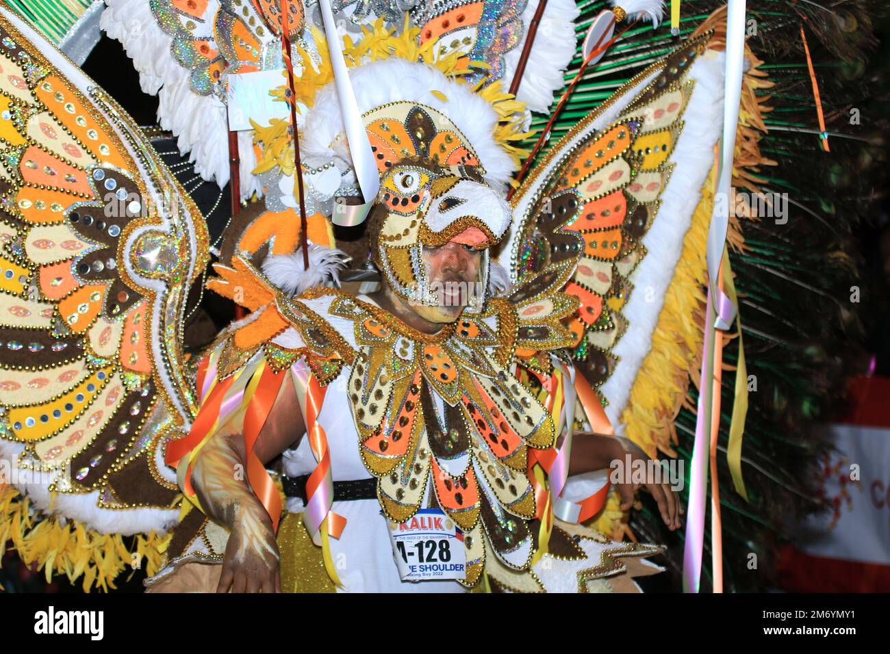 A man in a traditional costume during a Junkanoo parade in the Bahamas ...