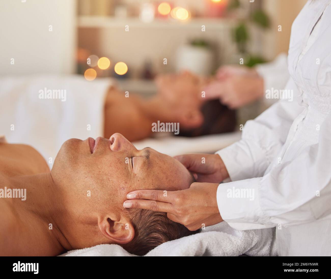 Massage, reiki and couple at spa with therapist hand, chakra balance ...