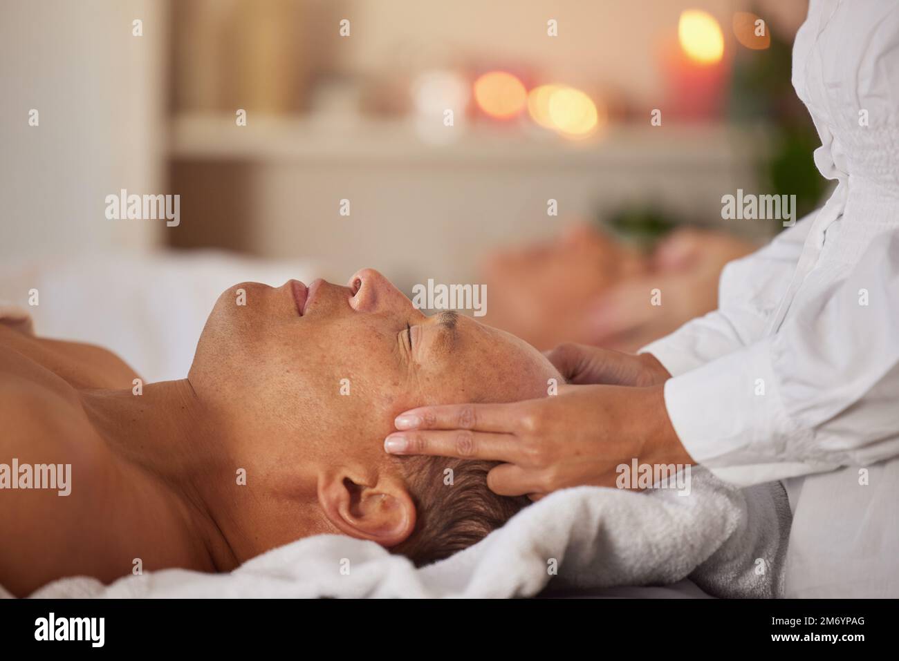 Massage, reiki and couple at spa with therapist hand, chakra balance with wellness, spiritual ...