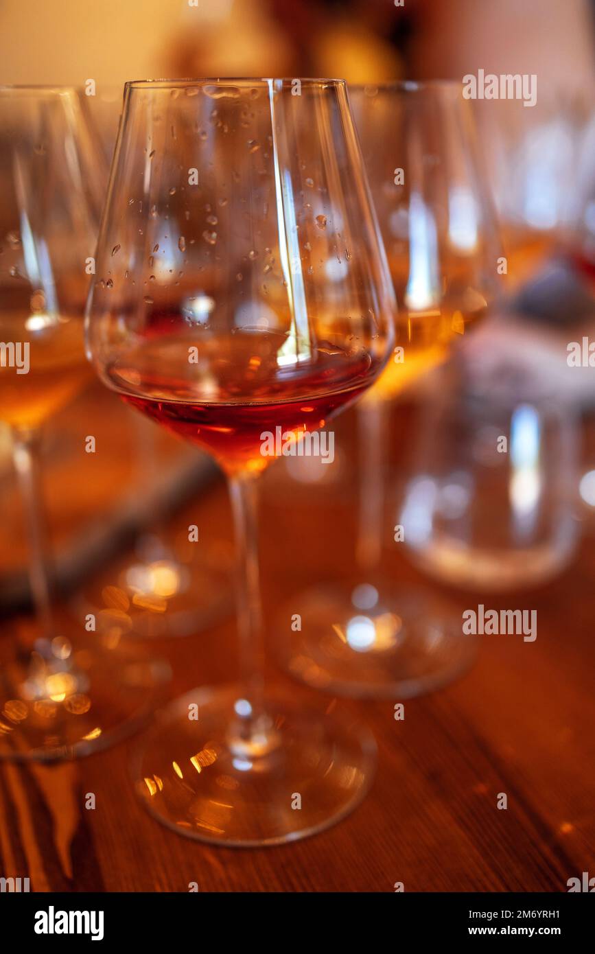 Glass goblets placed in rows on table during wine tasting procedure in ...