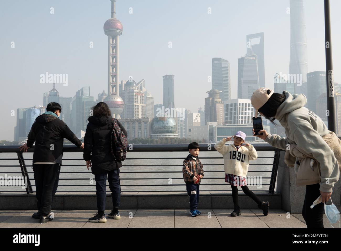 SHANGHAI, CHINA - JANUARY 6, 2023 - Tourists visit the Bund in Shanghai ...