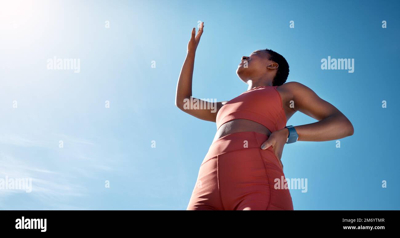 Fitness, blue sky and mockup with a sports black woman blocking the sun ...