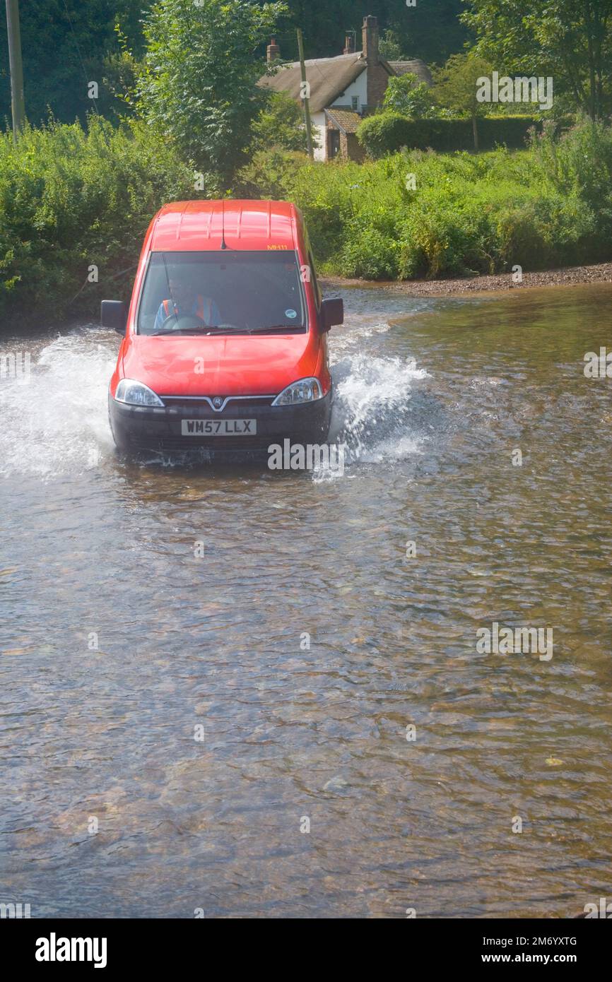 red post office van crossing the ford in dunster Gallox bridge exmoor ...