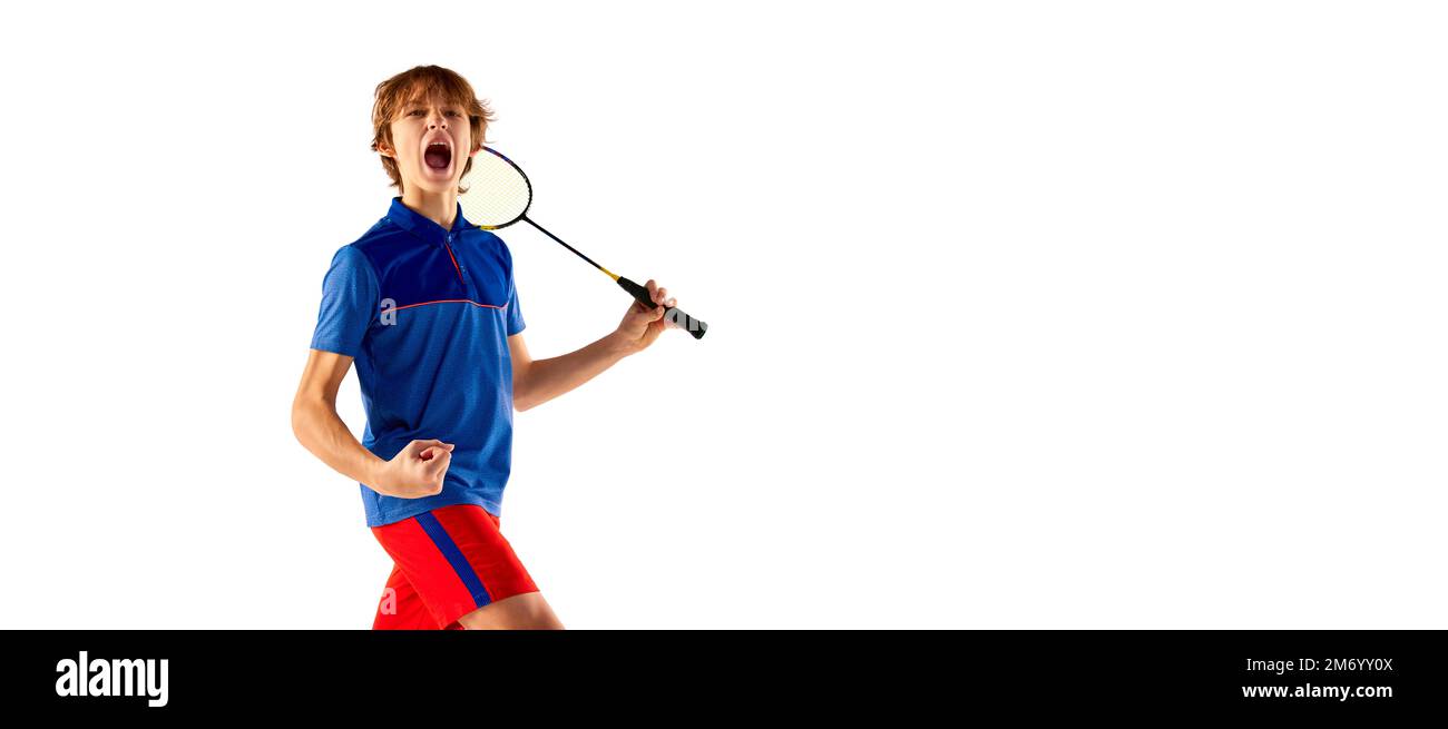 Portrait of teen boy in uniform, badminton player after successful game ...