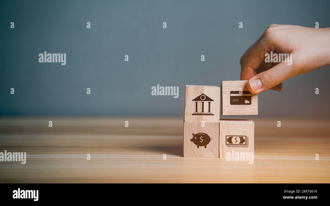 Hand arranging wood block stacking with icon online transaction, credit ...