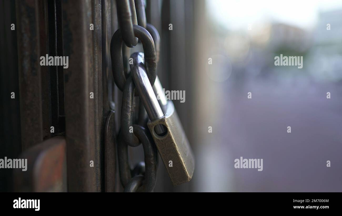 Store front gate closed, close-up lock Stock Photo - Alamy