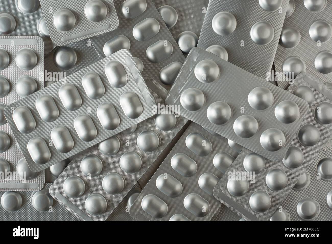 pile of silver color blister packs, medical drugs for allergies ...