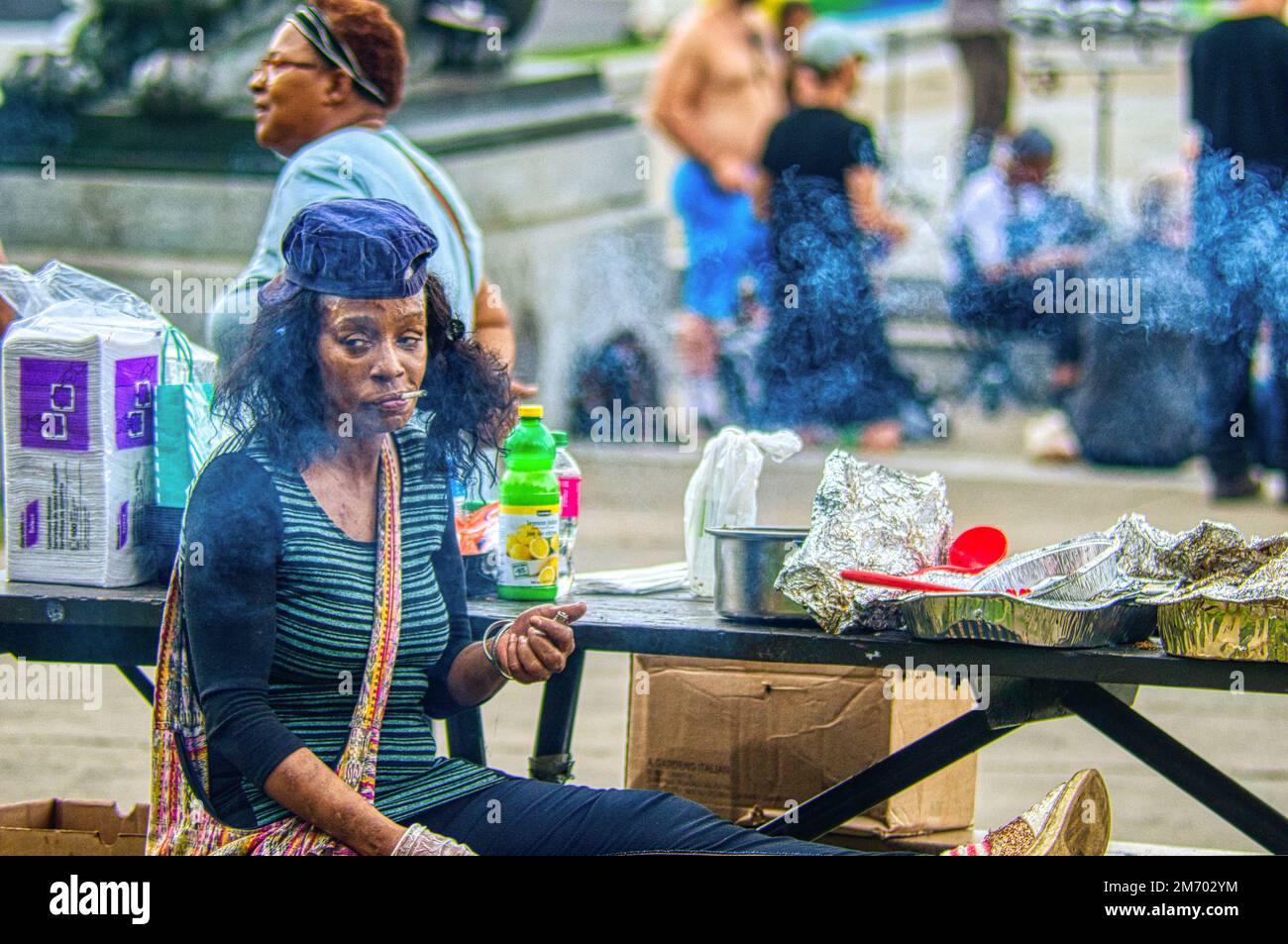 People enjoying early summer weather at a drum circle at Monument a sir ...