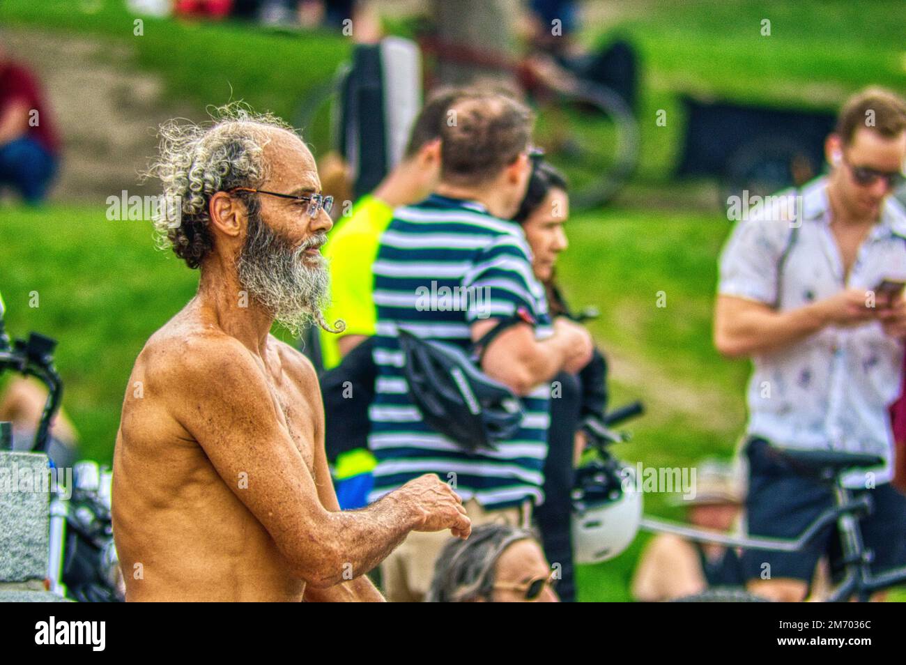 People enjoying early summer weather at a drum circle at Monument a sir ...