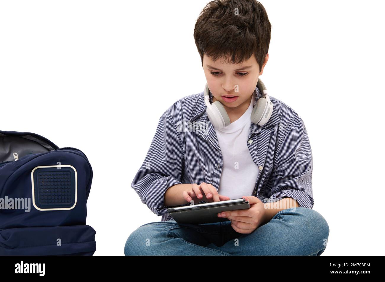 Caucasian smart elementary student, teen boy working on his school ...