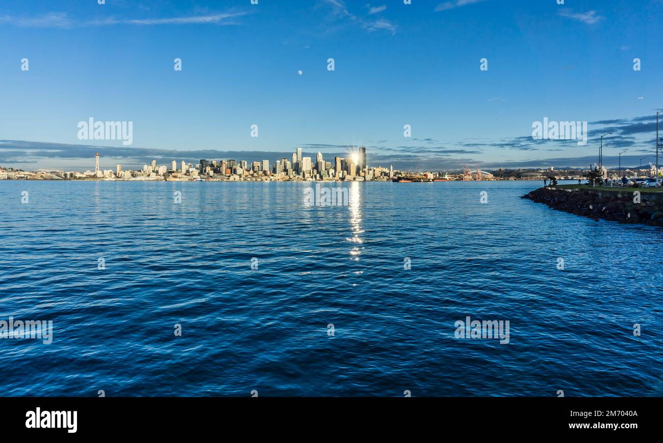 The sun reflects from buildings in the skyline of Seattle, Washington ...