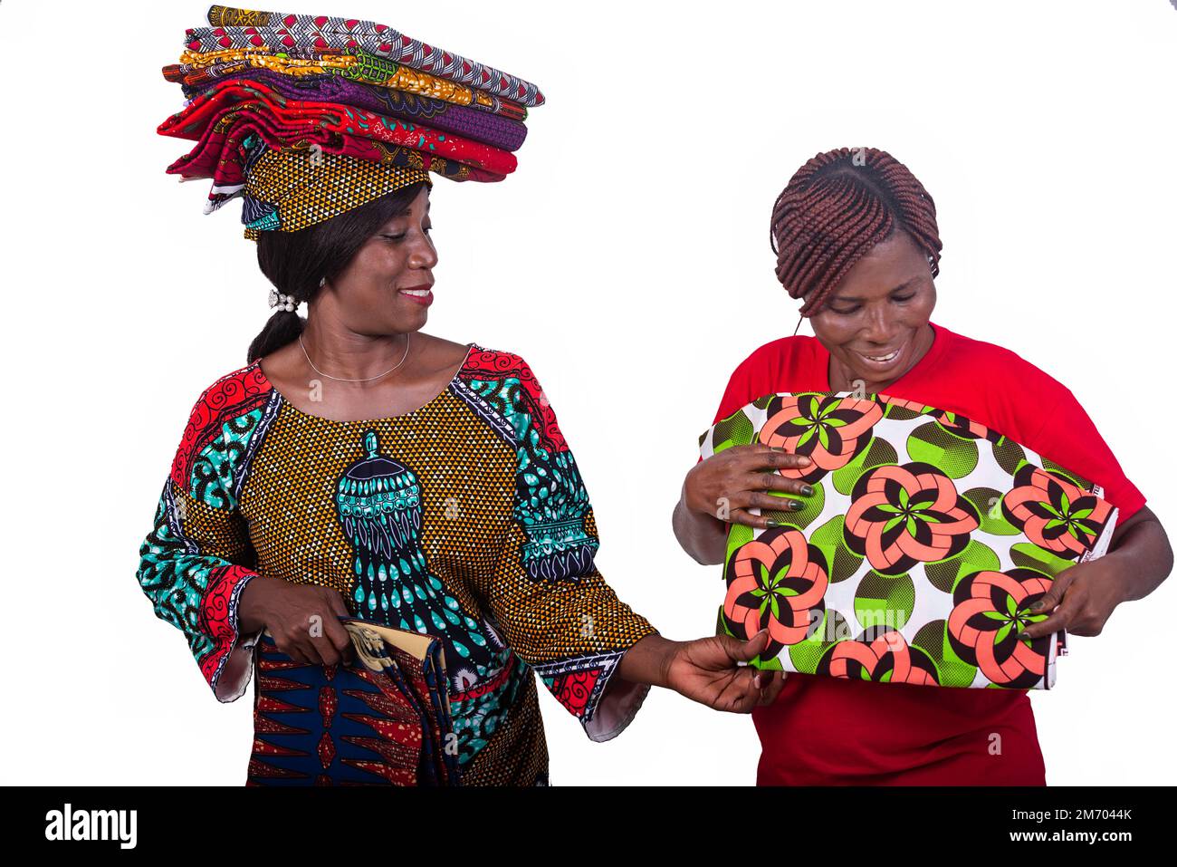 portrait of a beautiful woman showing different traditional loincloths ...