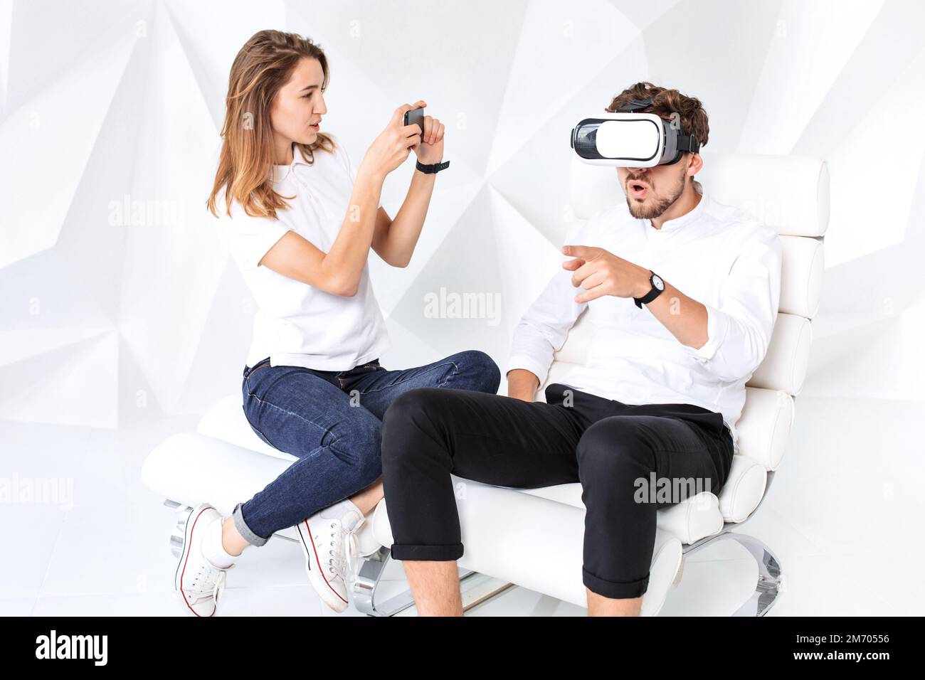 Couple having fun playing with virtual reality Stock Photo - Alamy