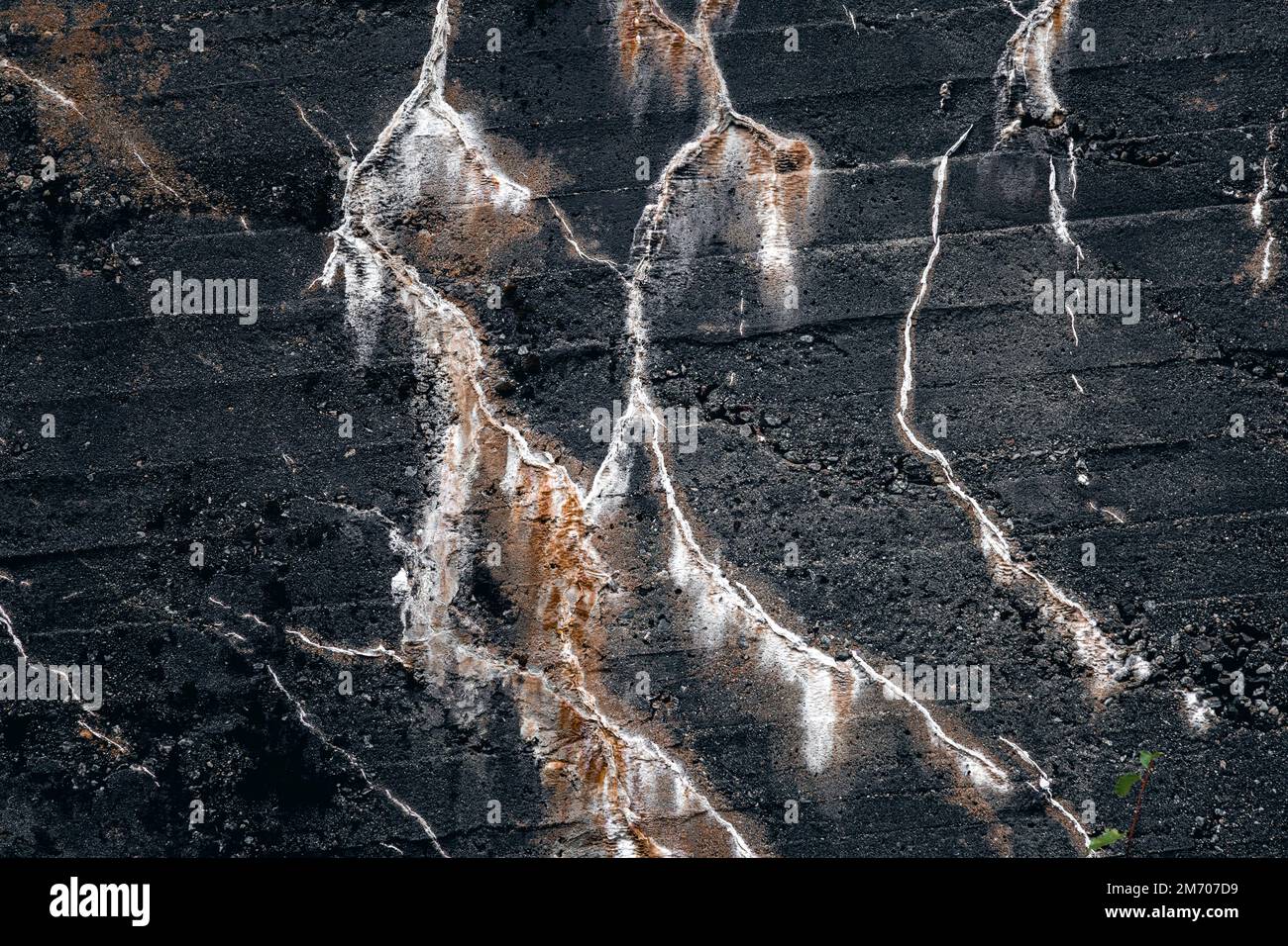 A crack in the rock face resembling a lightning Stock Photo - Alamy