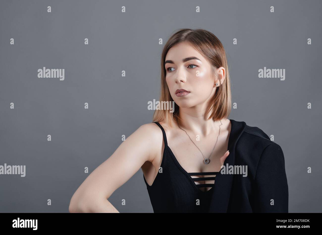 Pretty girl, portrait in the studio, elbow to the side Stock Photo - Alamy