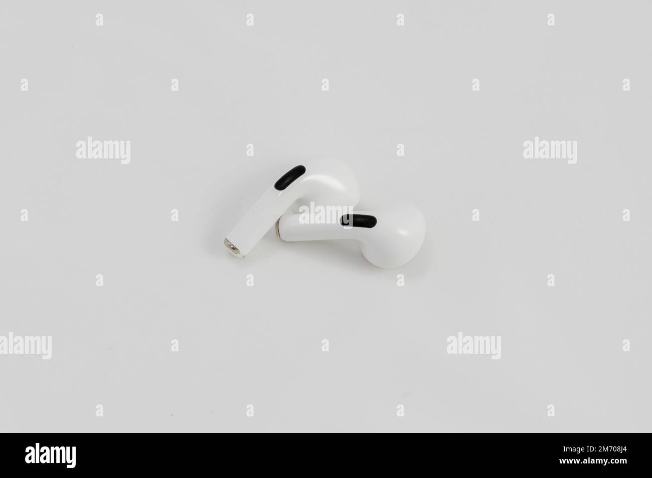 White wireless headphones on white background. Pair of Earbuds Stock ...