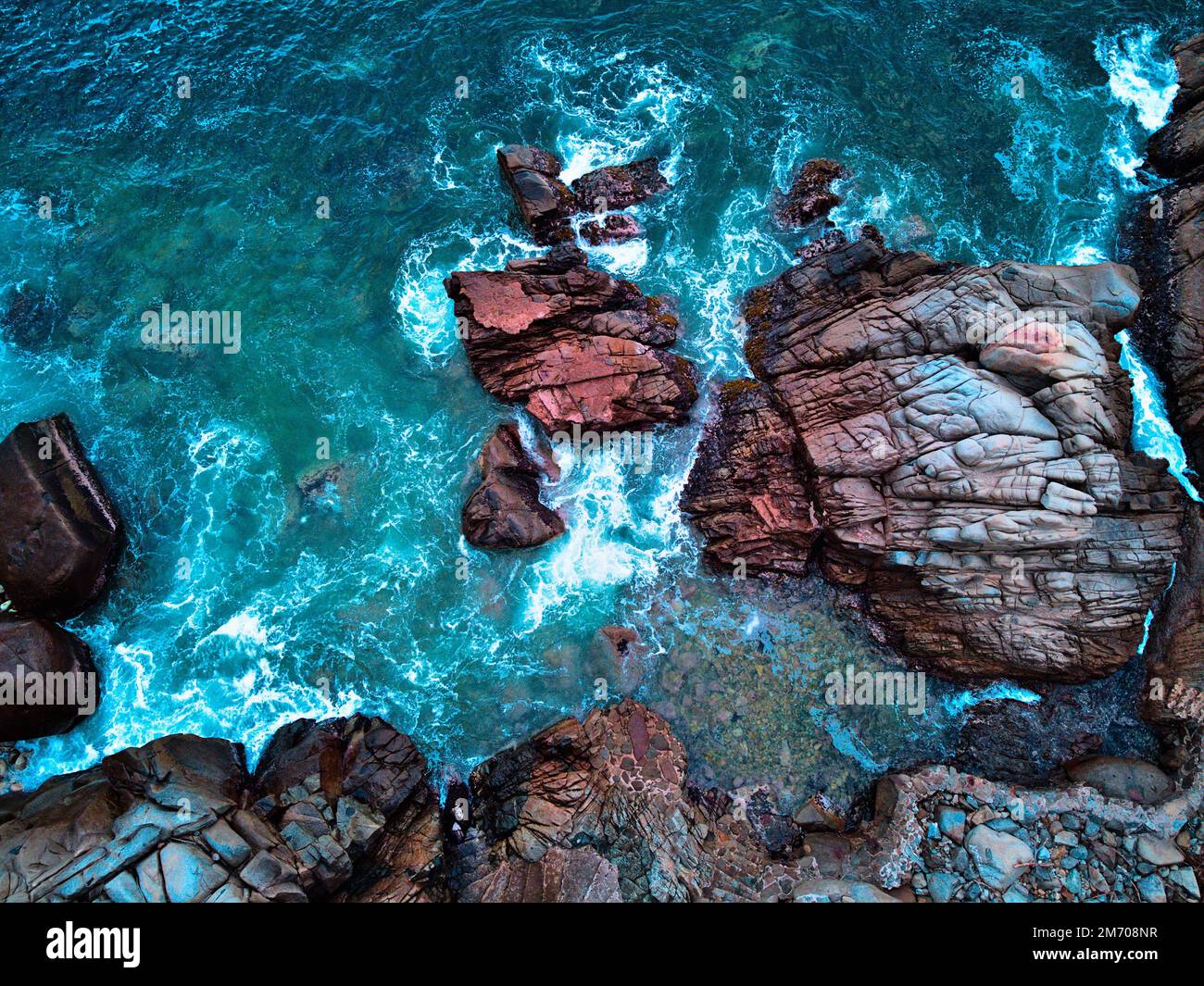 Colorful Rock and their shape formation by crashing waves over the ...