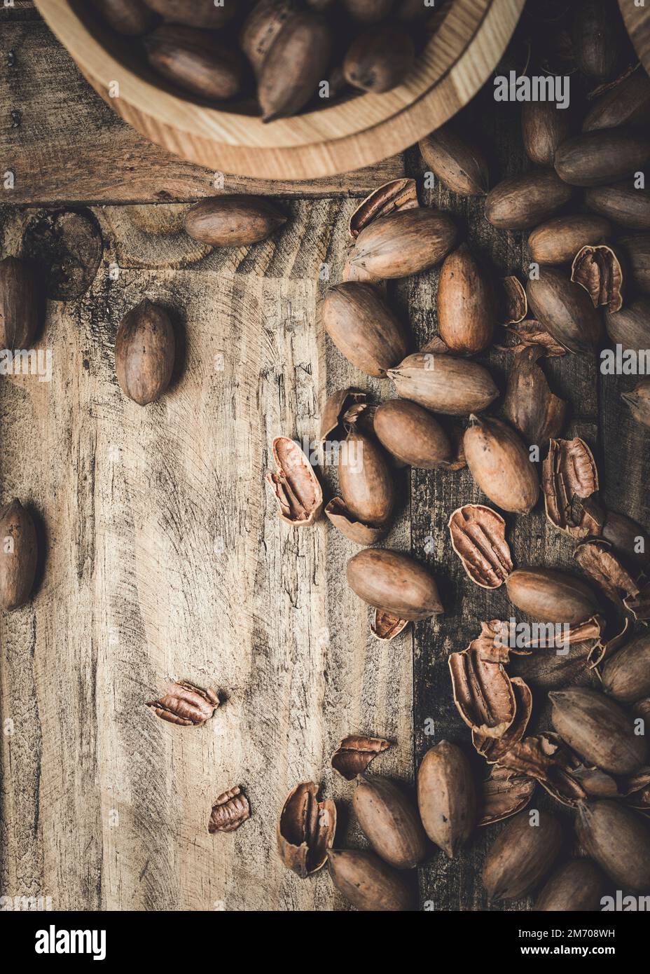 Fresh pecans and broken shells on a rustic wooden background Stock ...