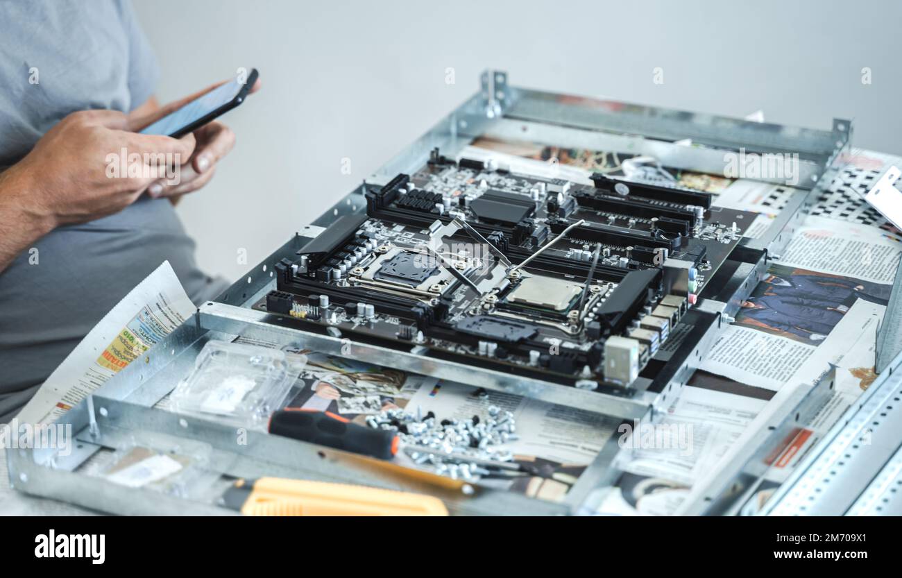 Man engineer,collector.Independent self computer assembly. Mounting ...